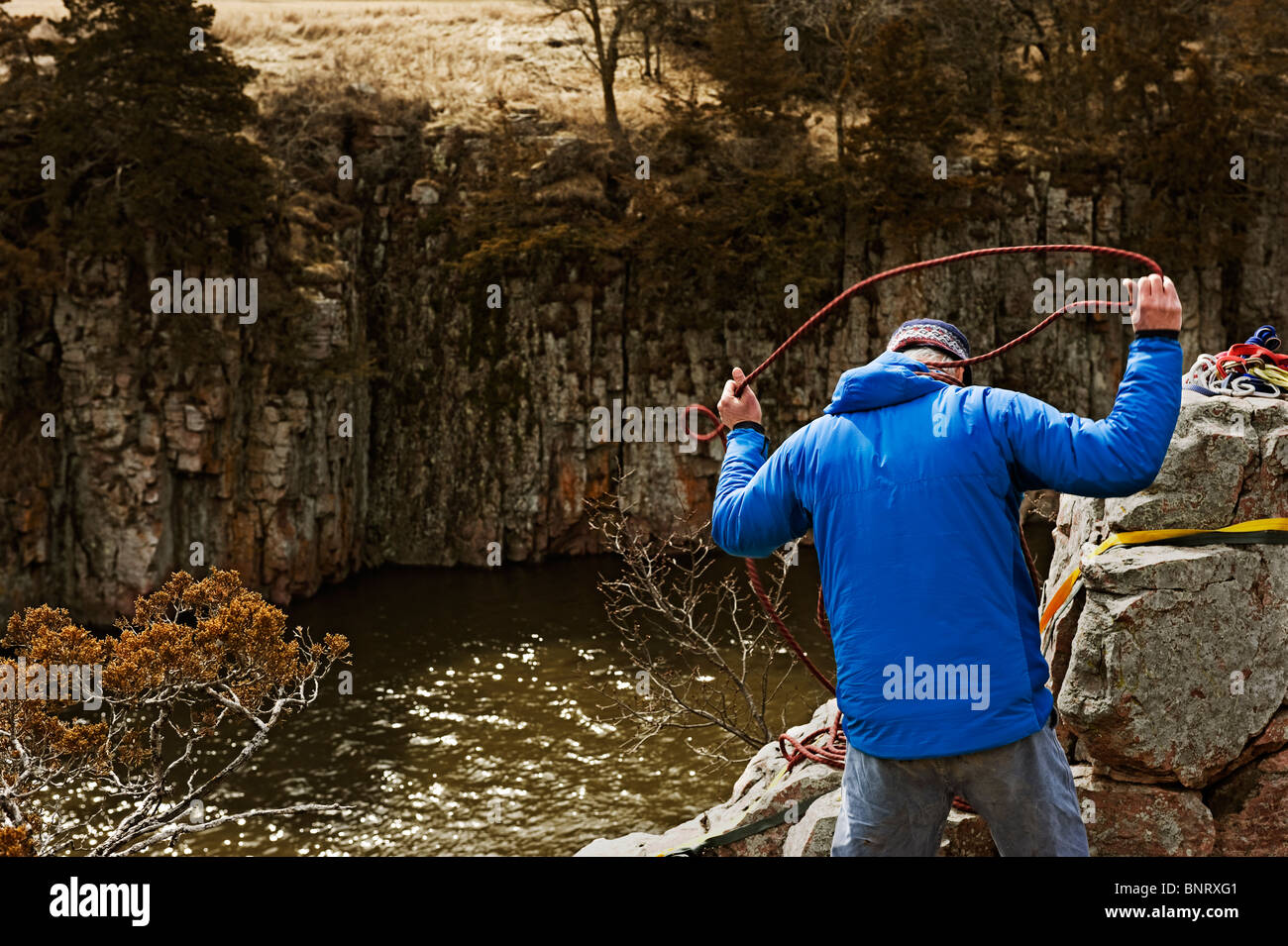 A man rigs top ropes at Palisades State Park, South Dakota Stock Photo ...