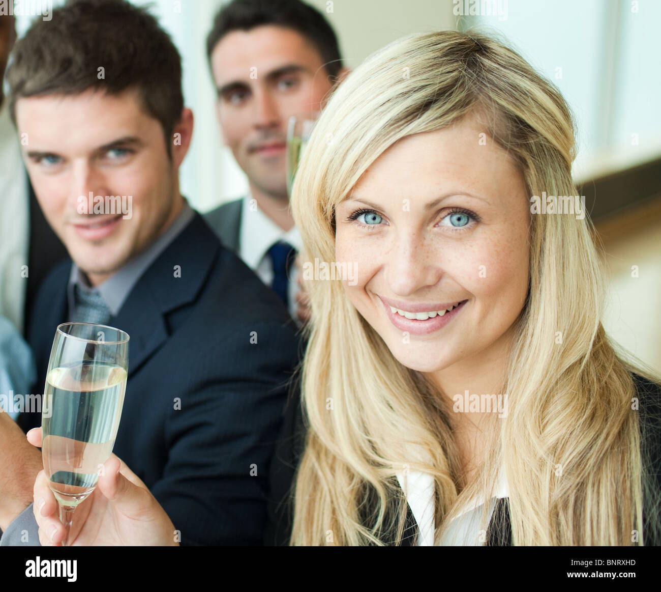 Portrait happy businesspeople toasting hi-res stock photography and ...
