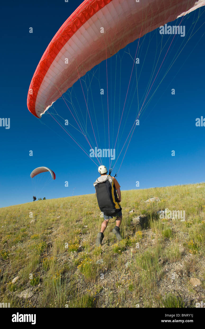 A paraglider finds the wind for a flight Stock Photo - Alamy