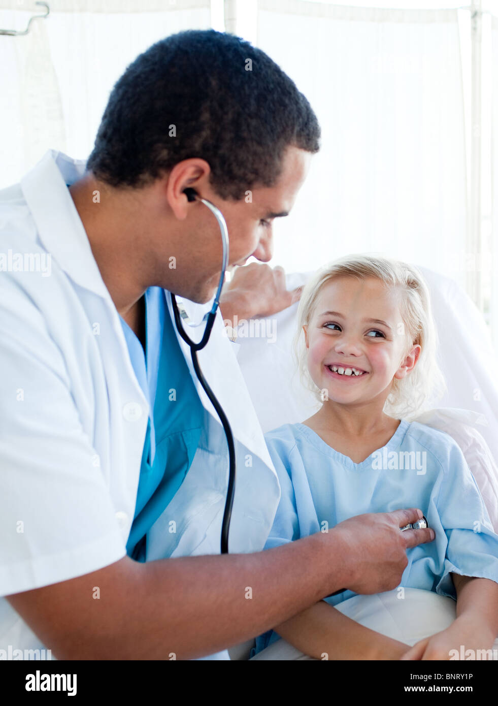 Nurse checking boy pulse hi-res stock photography and images - Alamy