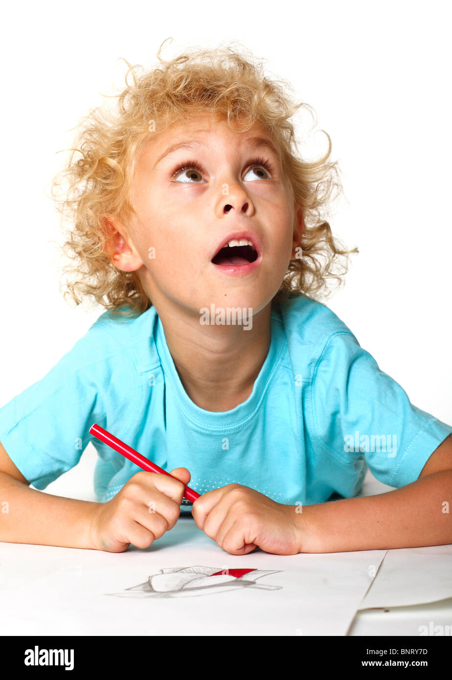 little caucasian kid drawing and thinking Stock Photo - Alamy