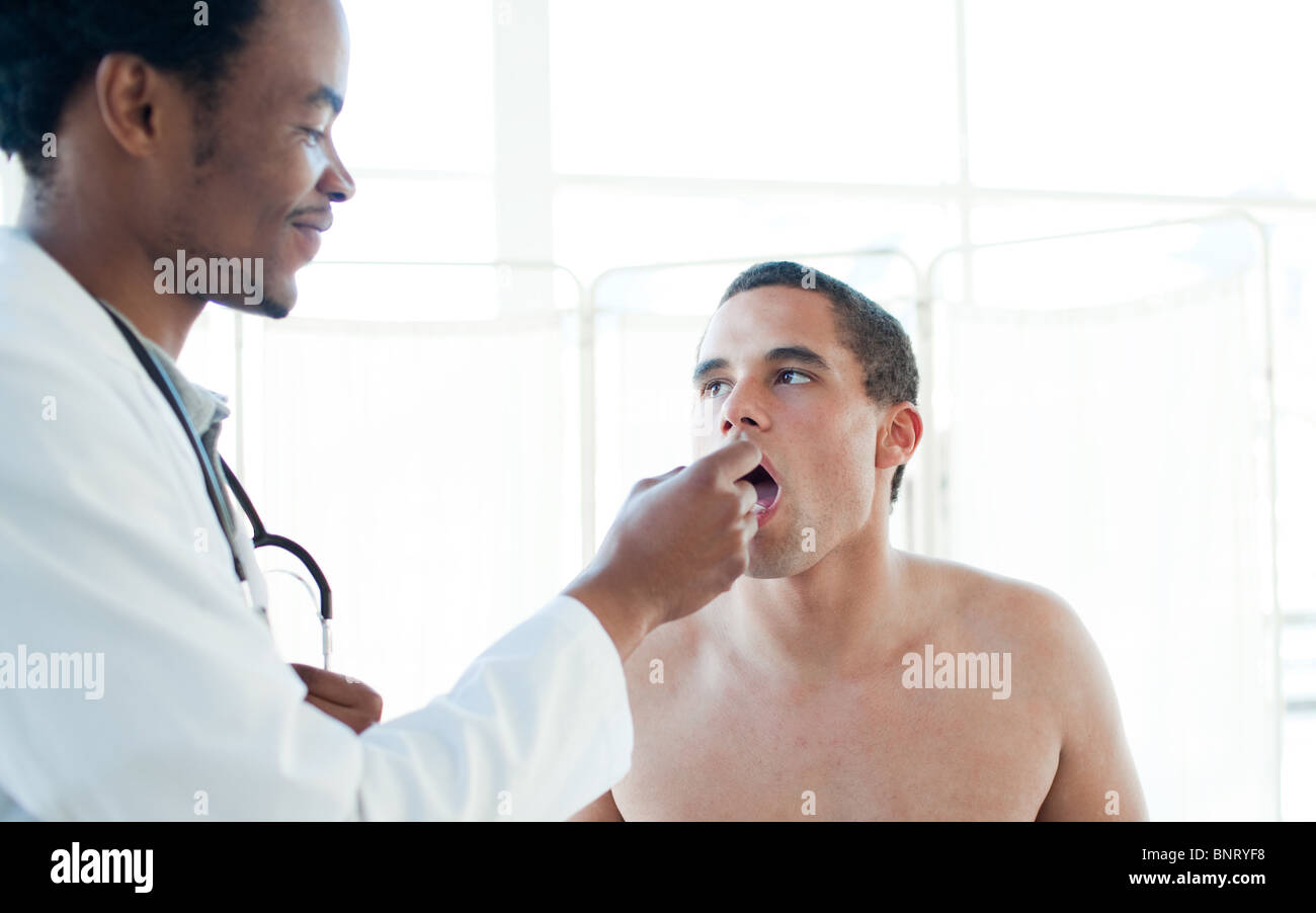 A doctor taking his patient's temperature Stock Photo - Alamy