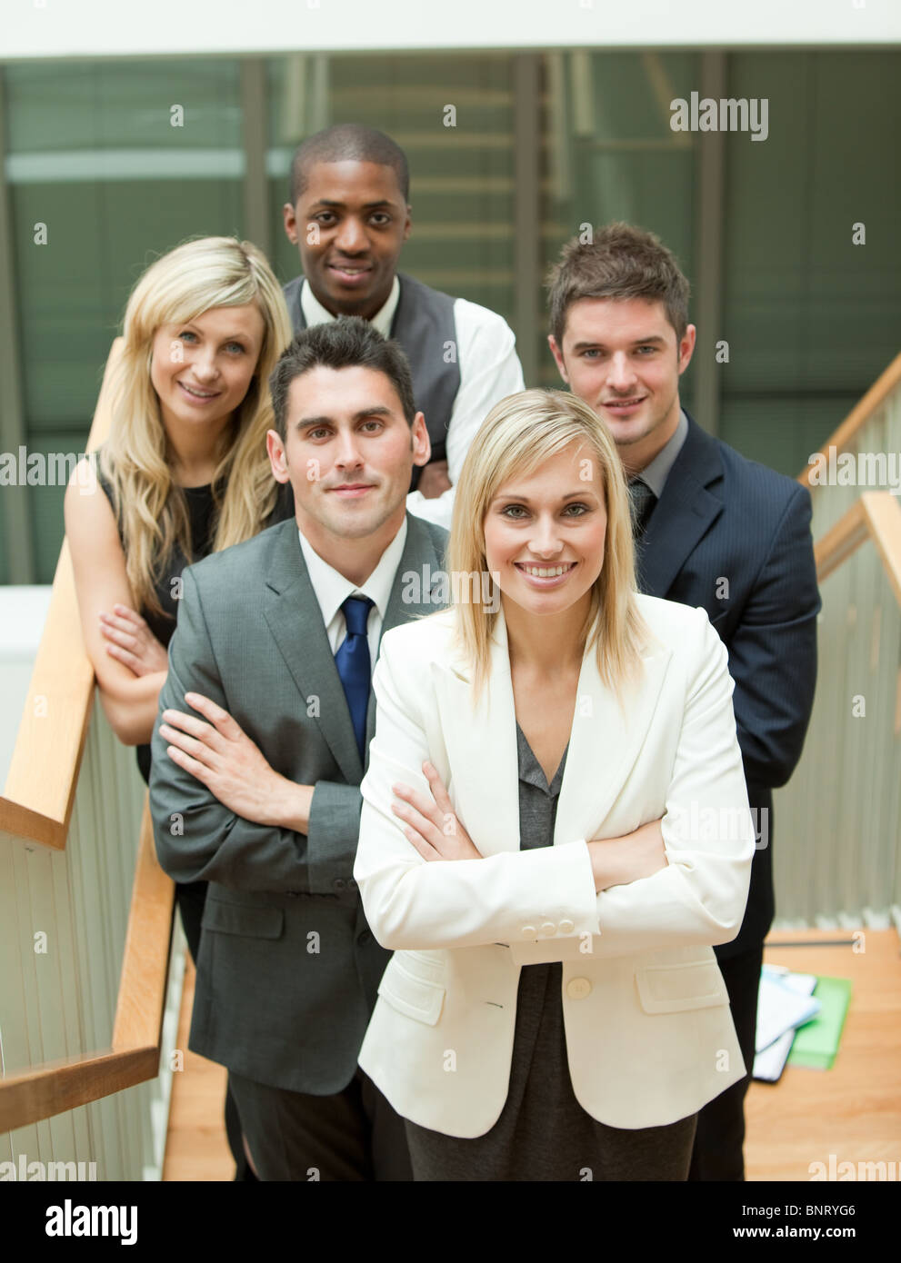 Diverse business team looking at the camera Stock Photo - Alamy