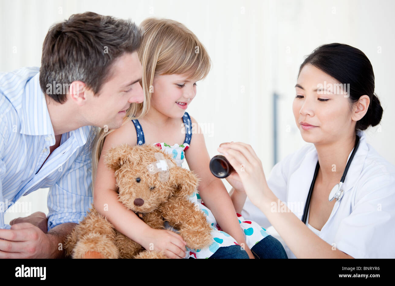 Confident female doctor giving syrup hi-res stock photography and ...