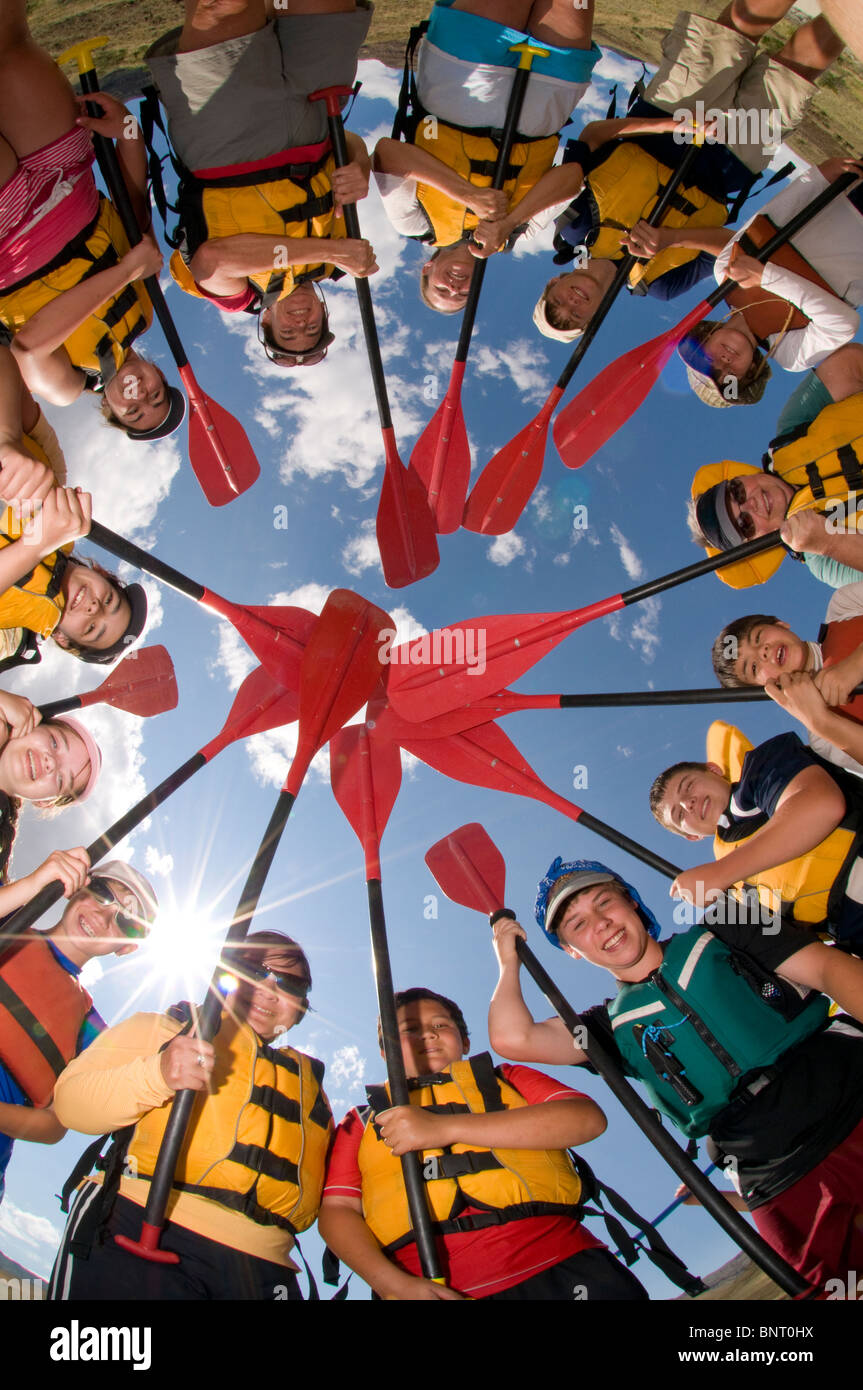 A large group of white water rafters with paddles Stock Photo - Alamy
