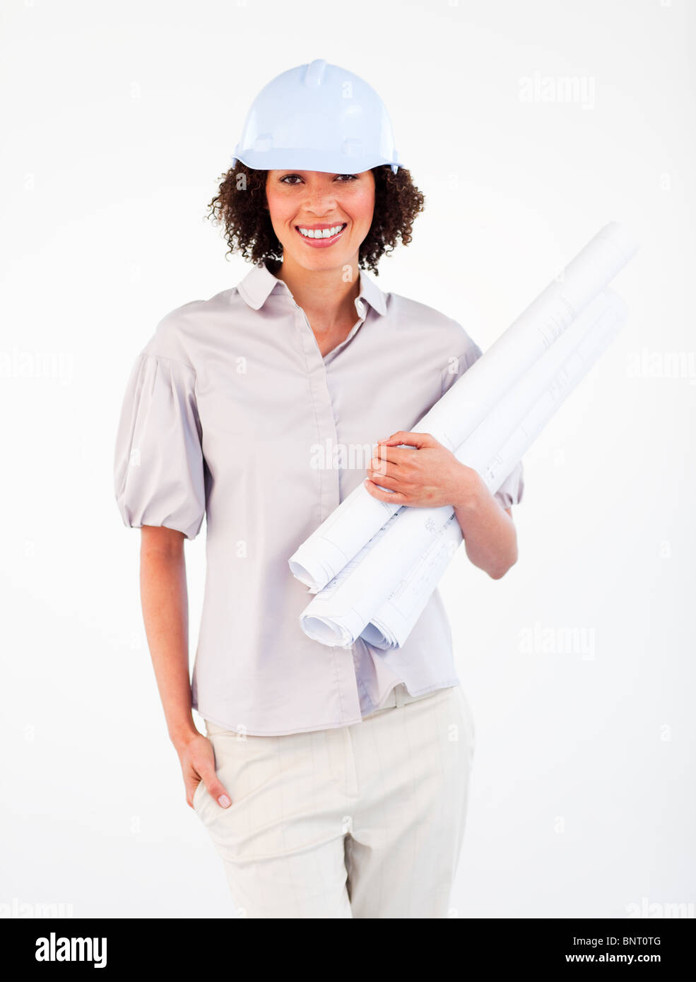 Smiling architect woman holding plans Stock Photo - Alamy