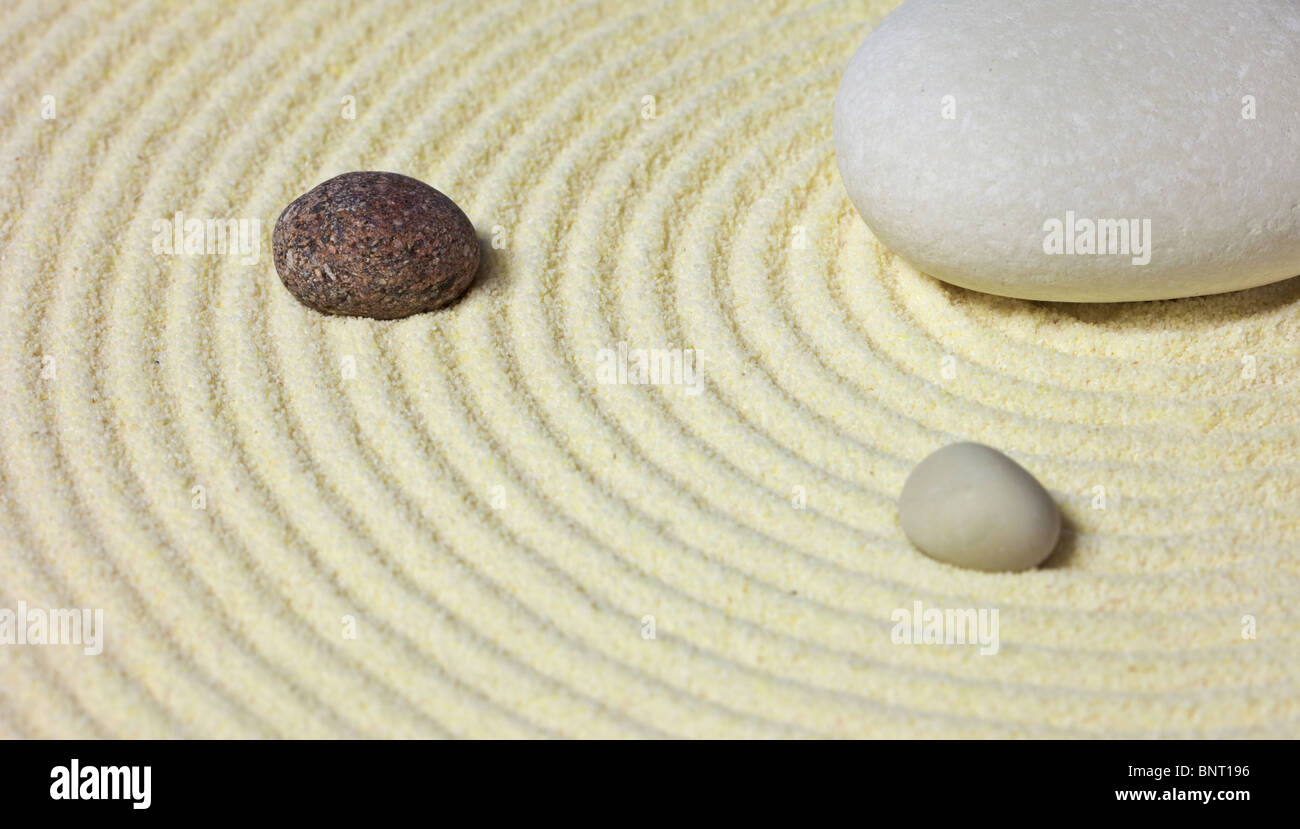 Abstract composition of a few stones on the sand Stock Photo - Alamy