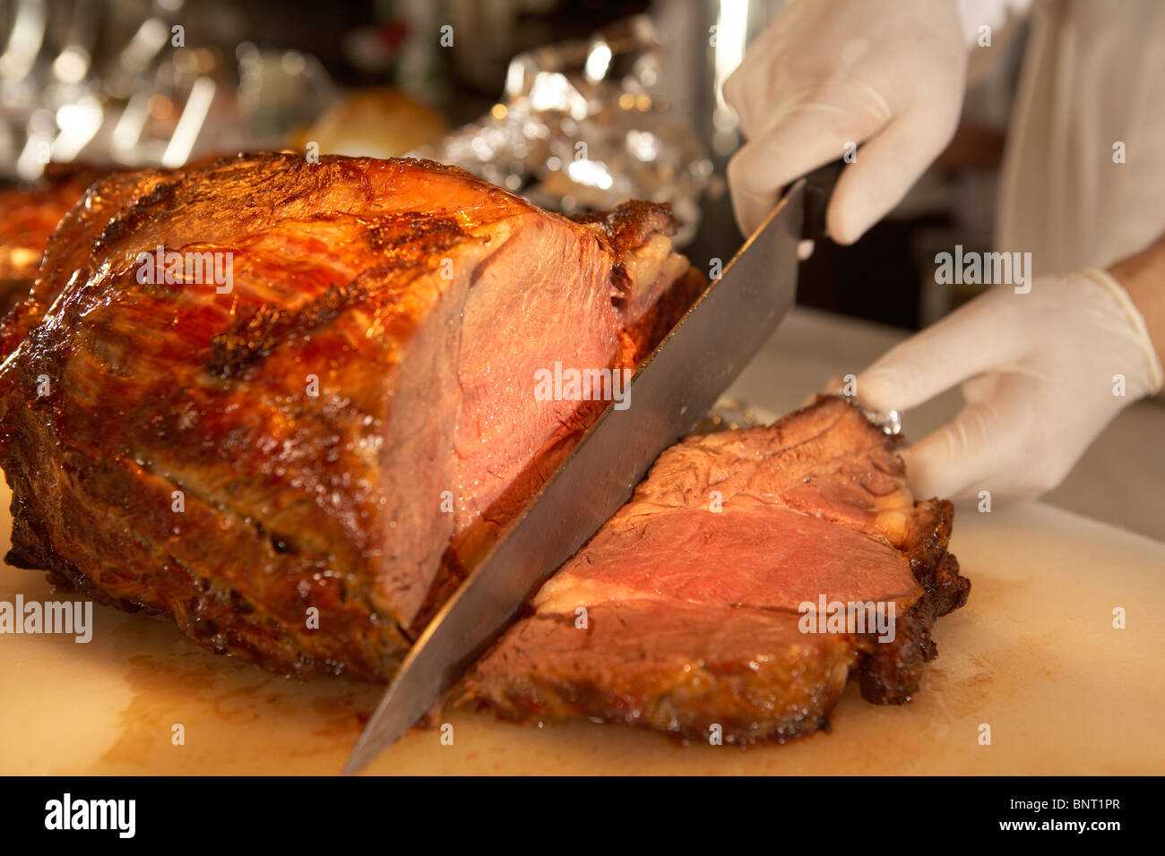 Chief cutting lamb Stock Photo - Alamy