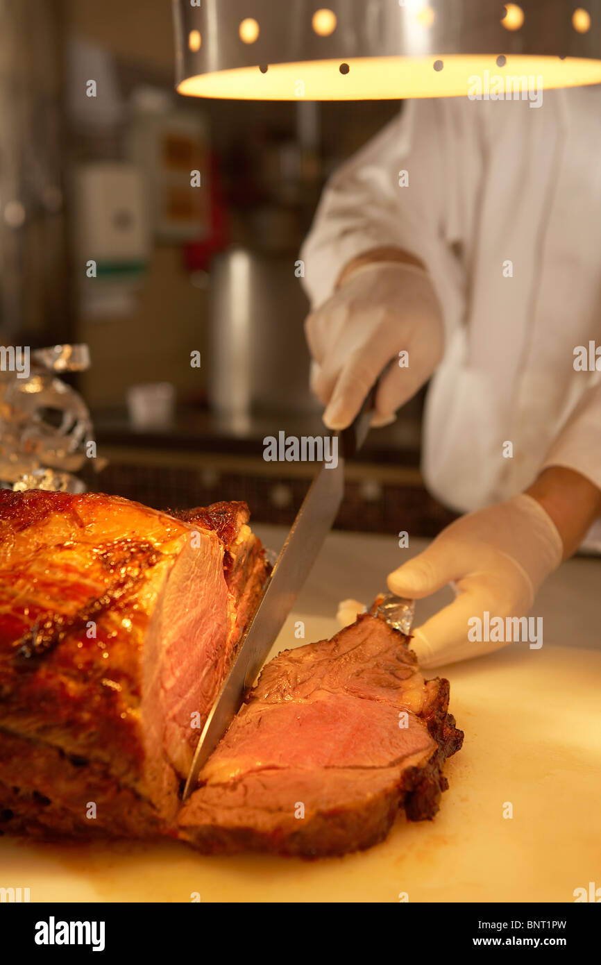 Chief cutting lamb Stock Photo - Alamy