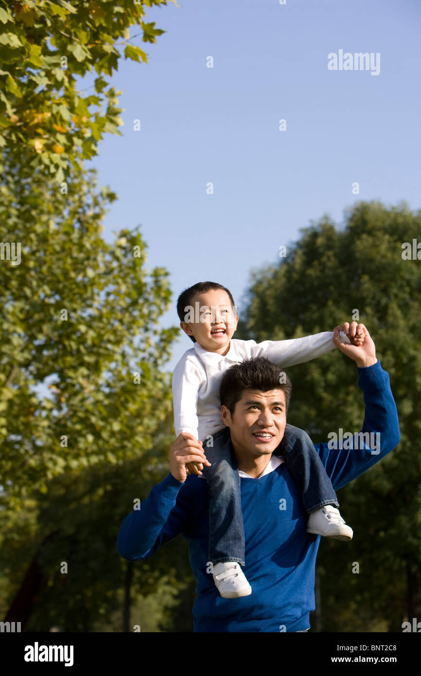 Portrait of father and son in the park Stock Photo - Alamy