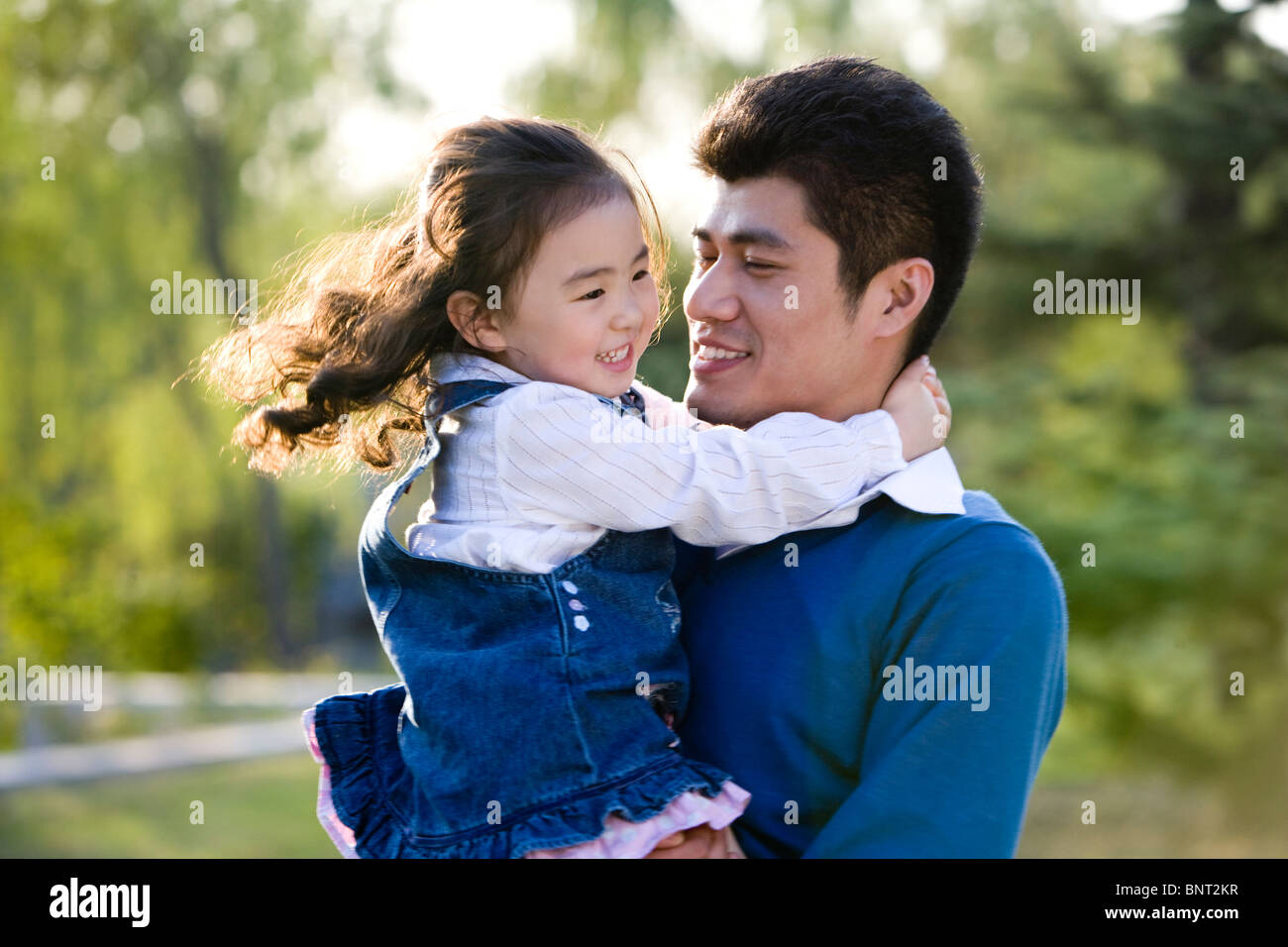 Portrait of father and daughter at the park Stock Photo - Alamy