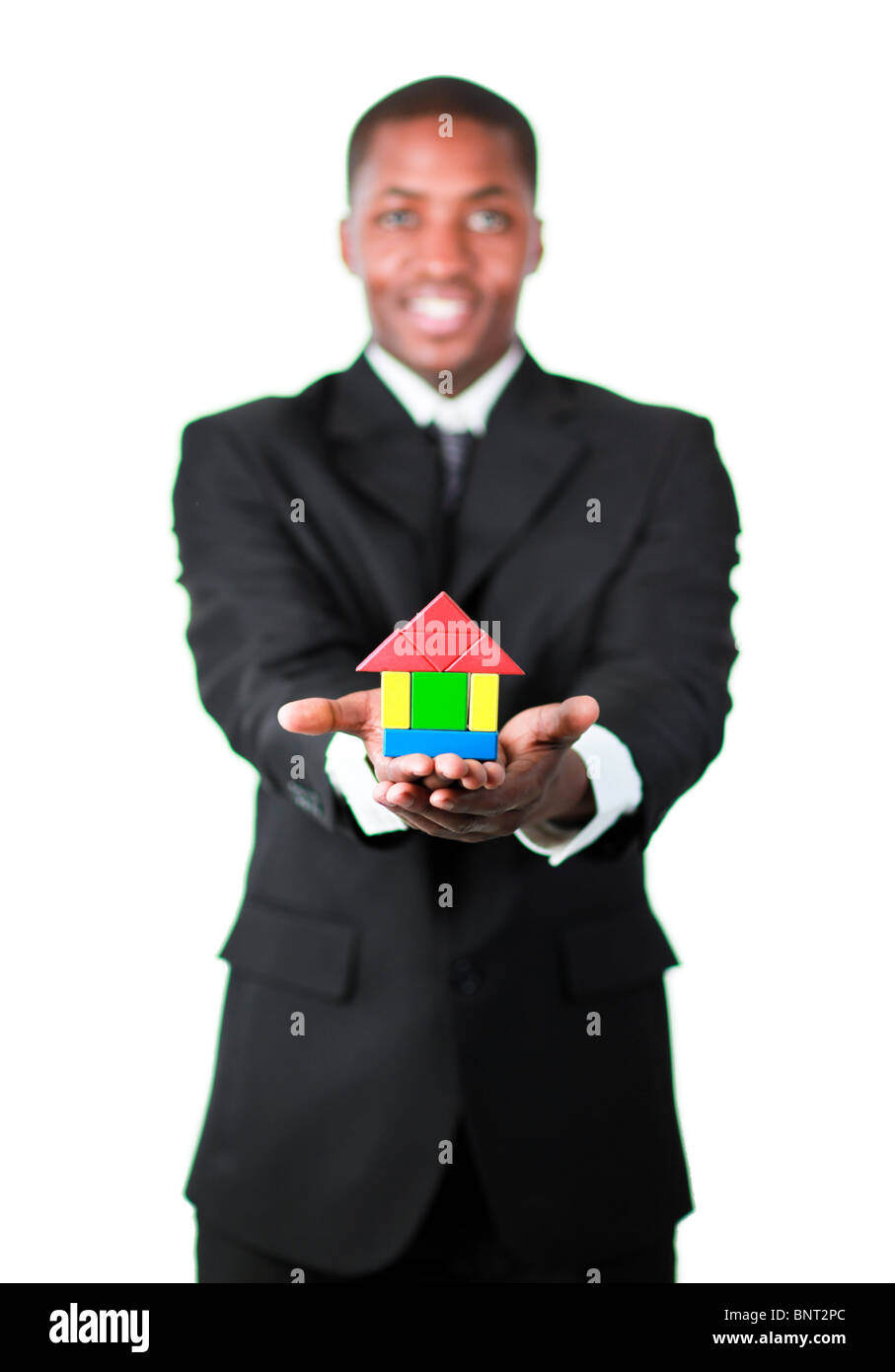 Happy businessman presenting a house Stock Photo - Alamy