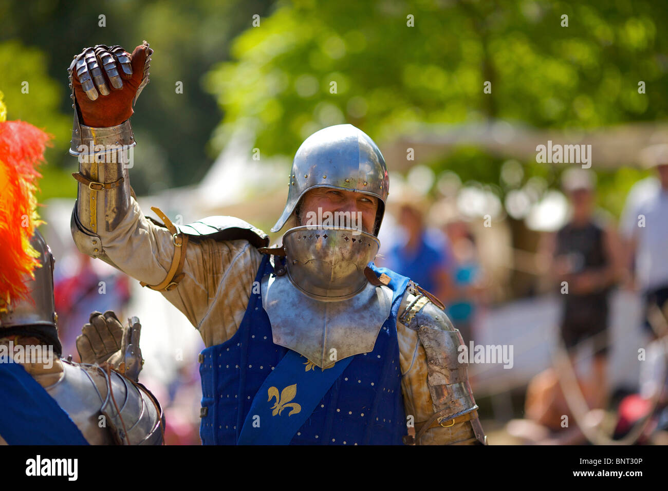 Dressed in authentic armour and using real swords re-enactors duel as ...