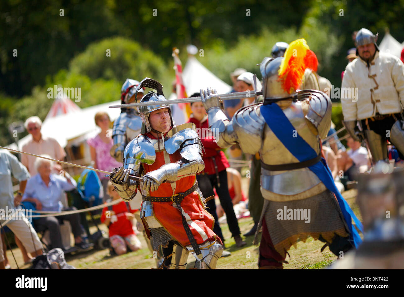 Dressed in authentic armour and using real swords re-enactors duel as ...