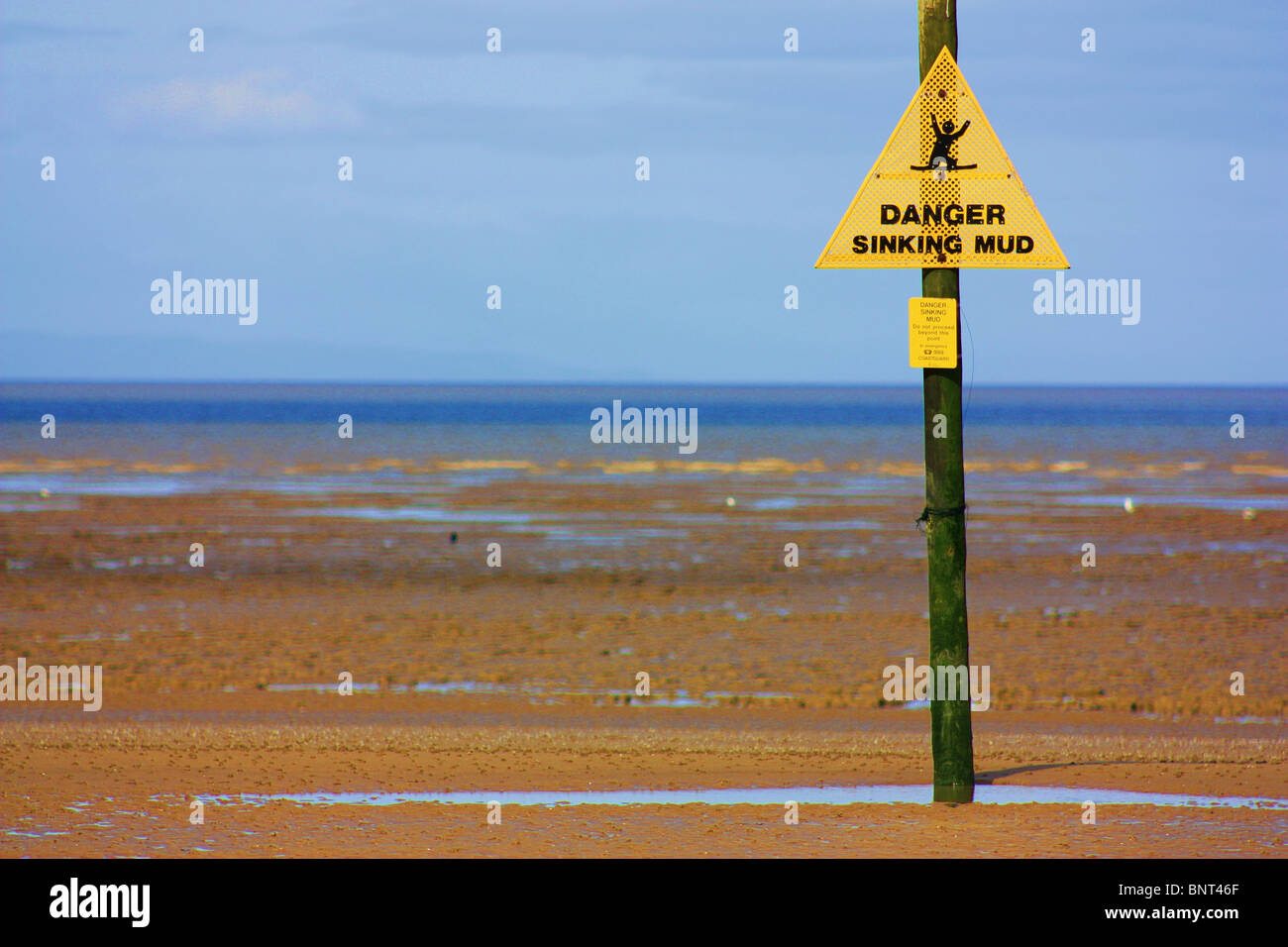 Warning sign of sinking mud at weston super mare , UK Stock Photo - Alamy