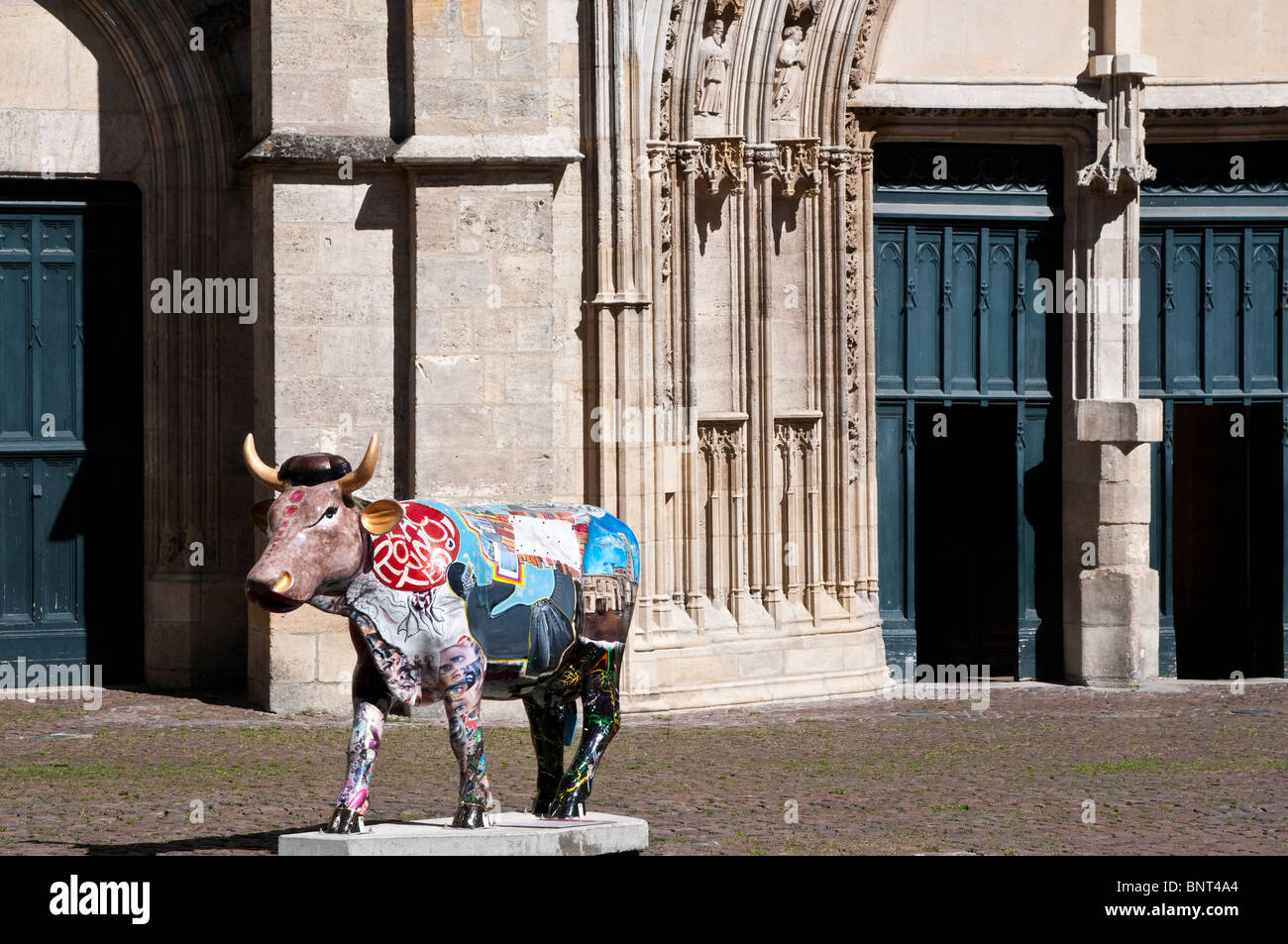 Painted sculpture of a cow, part of the Cow Parade event in front of ...