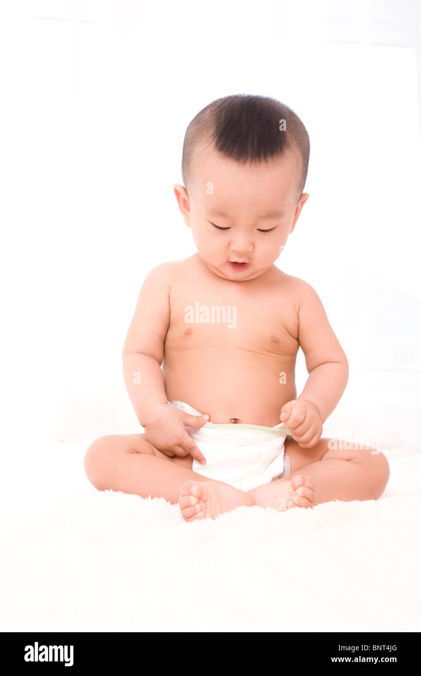 Baby in diapers Stock Photo - Alamy