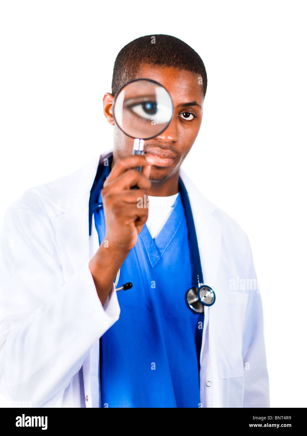 Smiling doctor looking through a magnifying glass Stock Photo - Alamy
