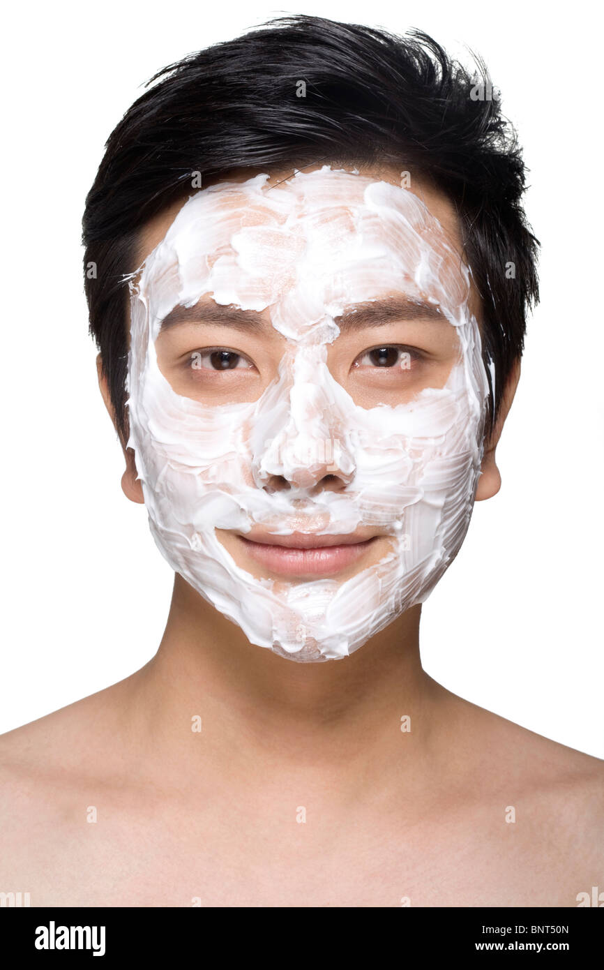 Handsome young man with facial mask Stock Photo - Alamy
