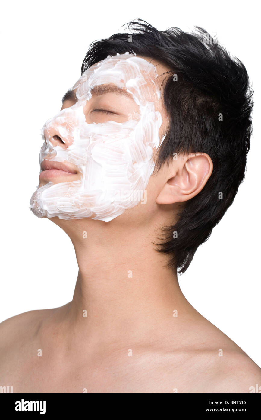 Handsome young man with facial mask Stock Photo - Alamy