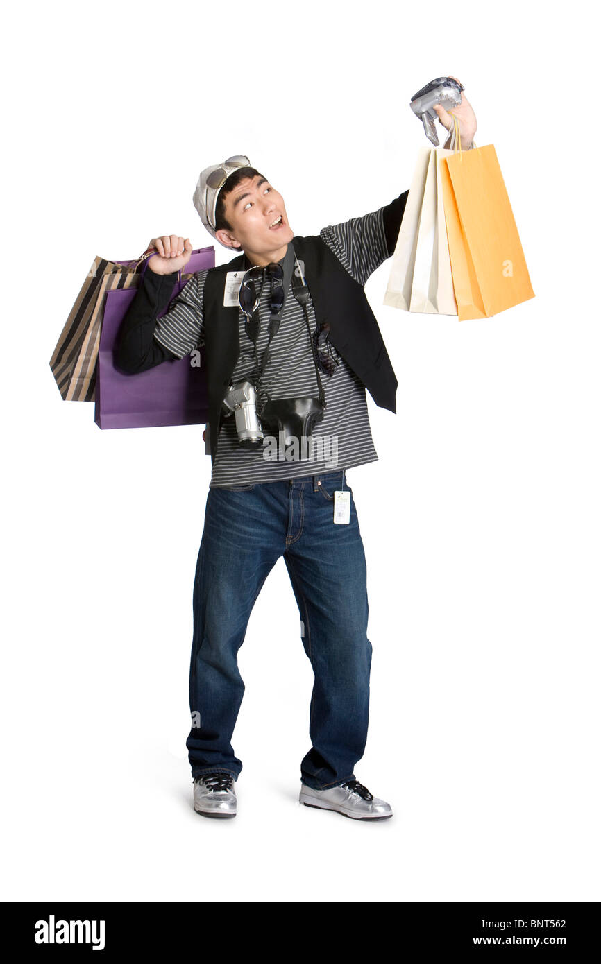 Young man busy shopping Stock Photo - Alamy