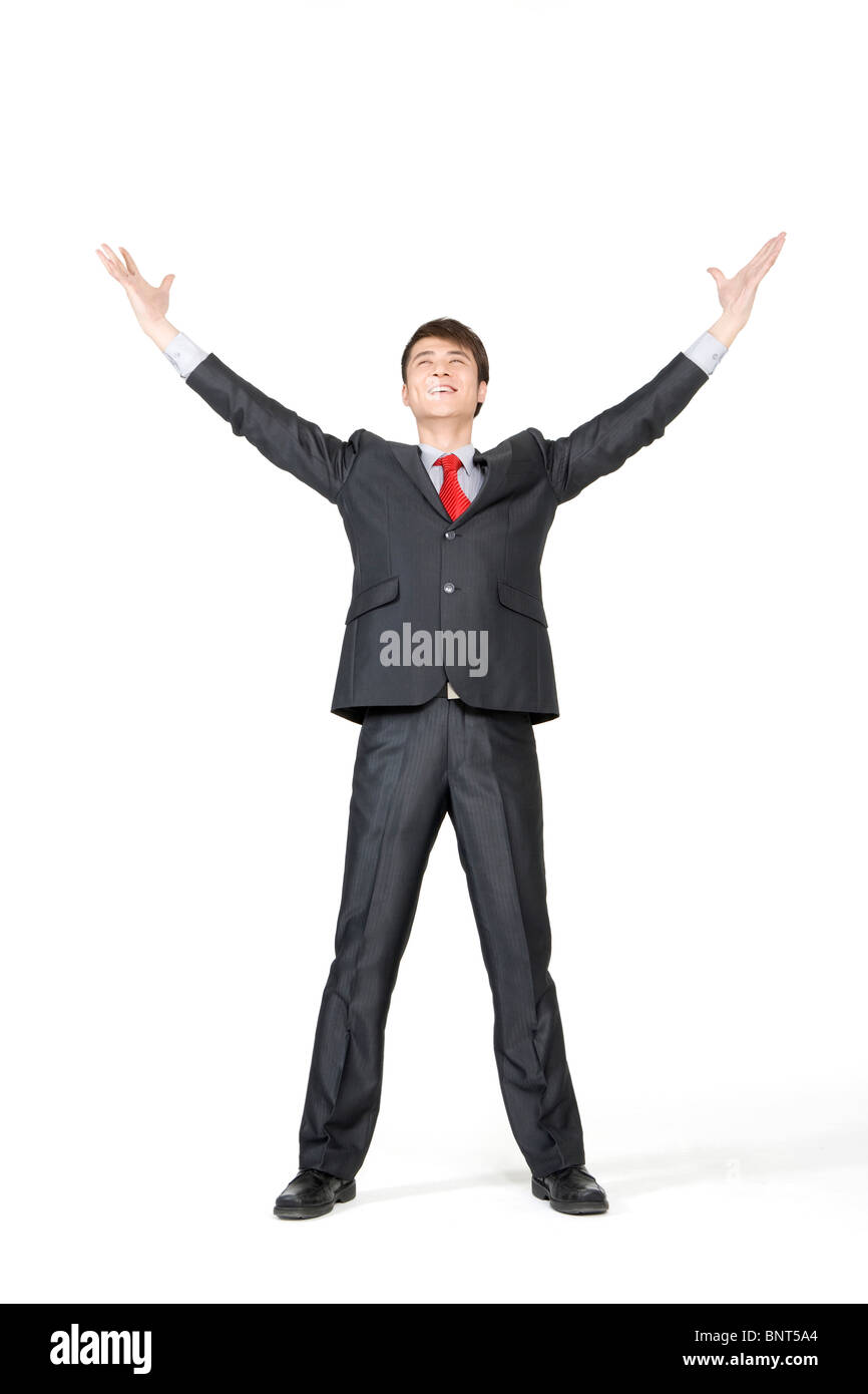 Young businessman with his arms extended Stock Photo - Alamy