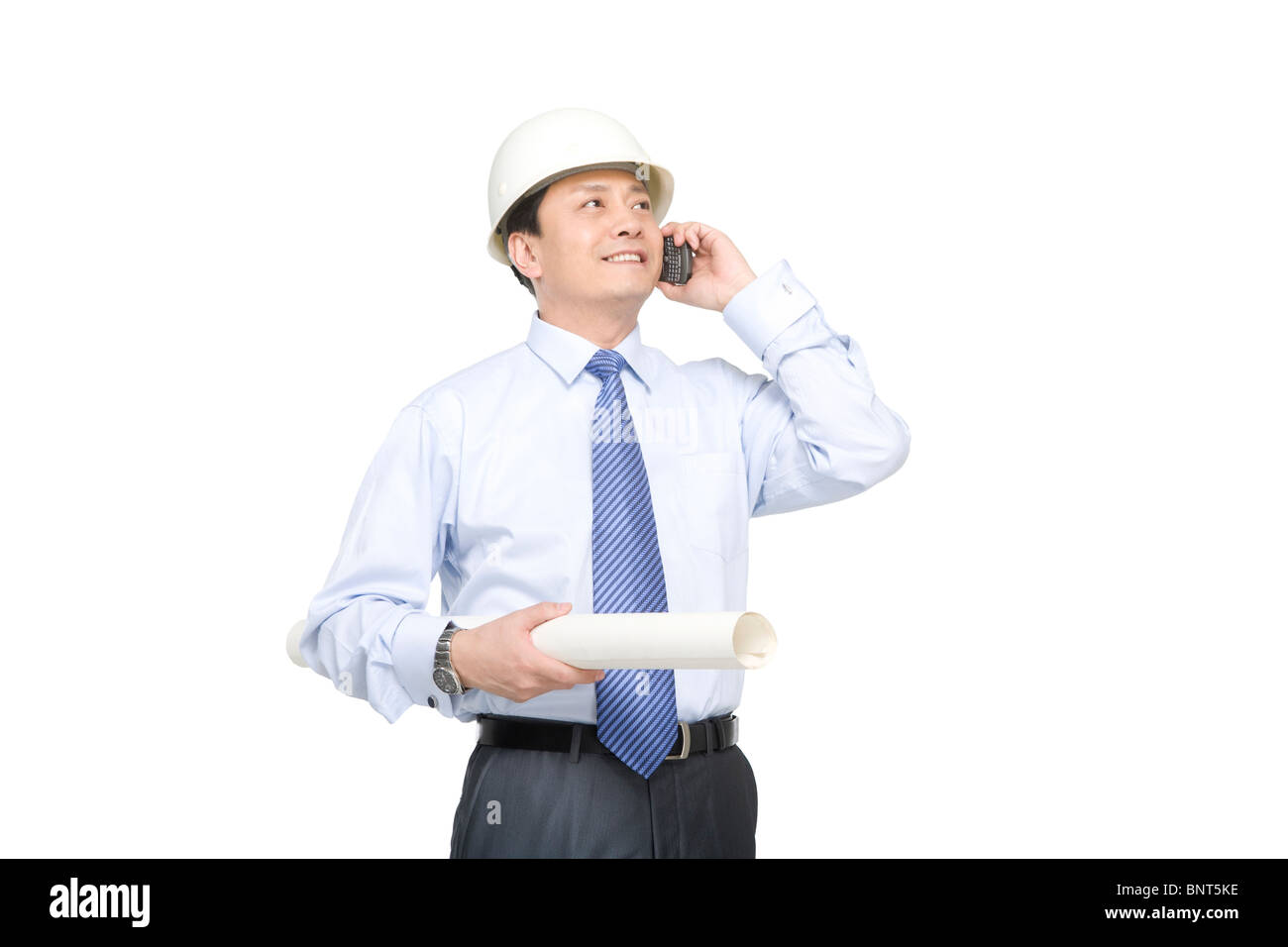 Construction management holding blueprints Stock Photo - Alamy