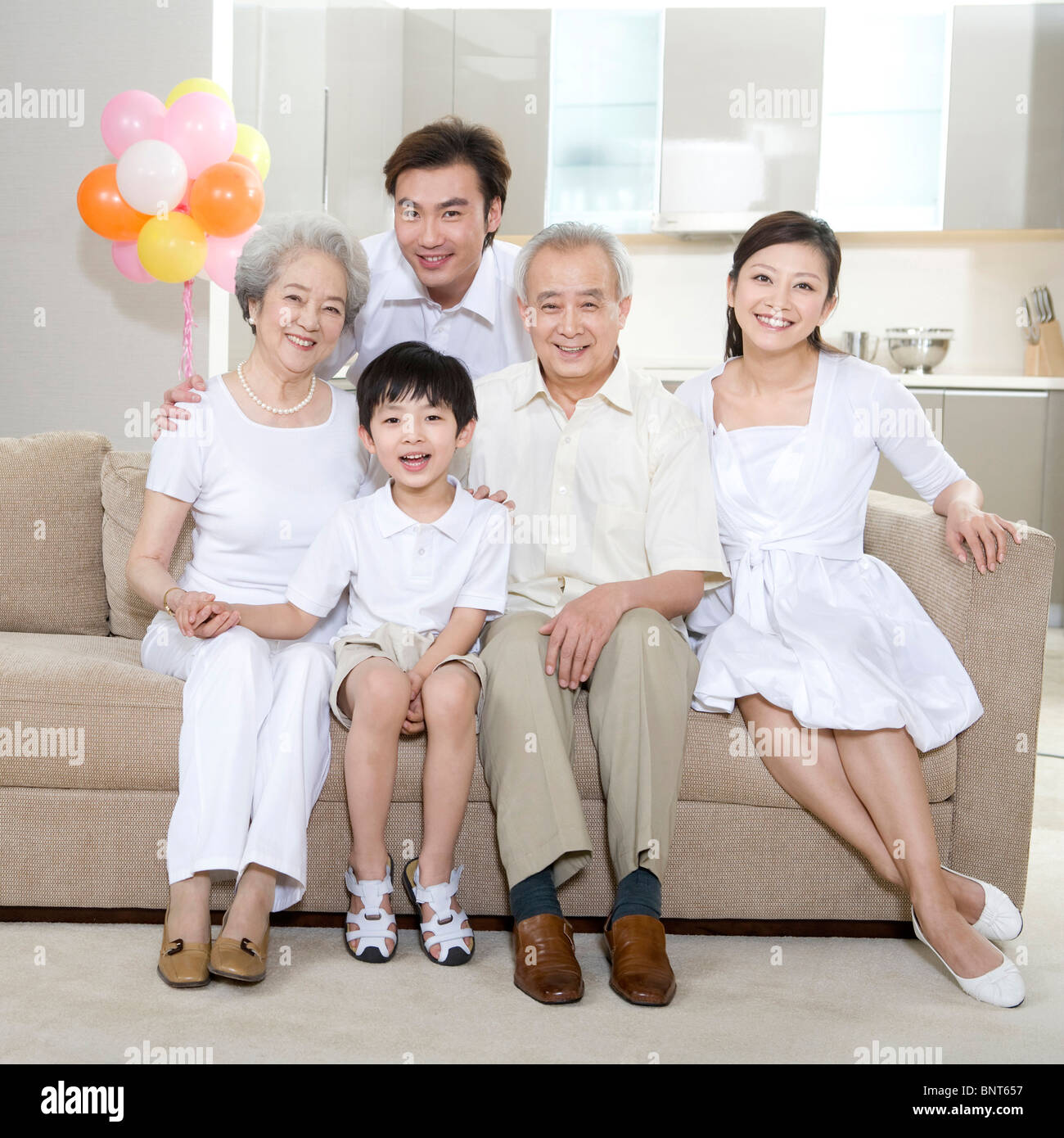 Portrait of a three generation family at home Stock Photo - Alamy