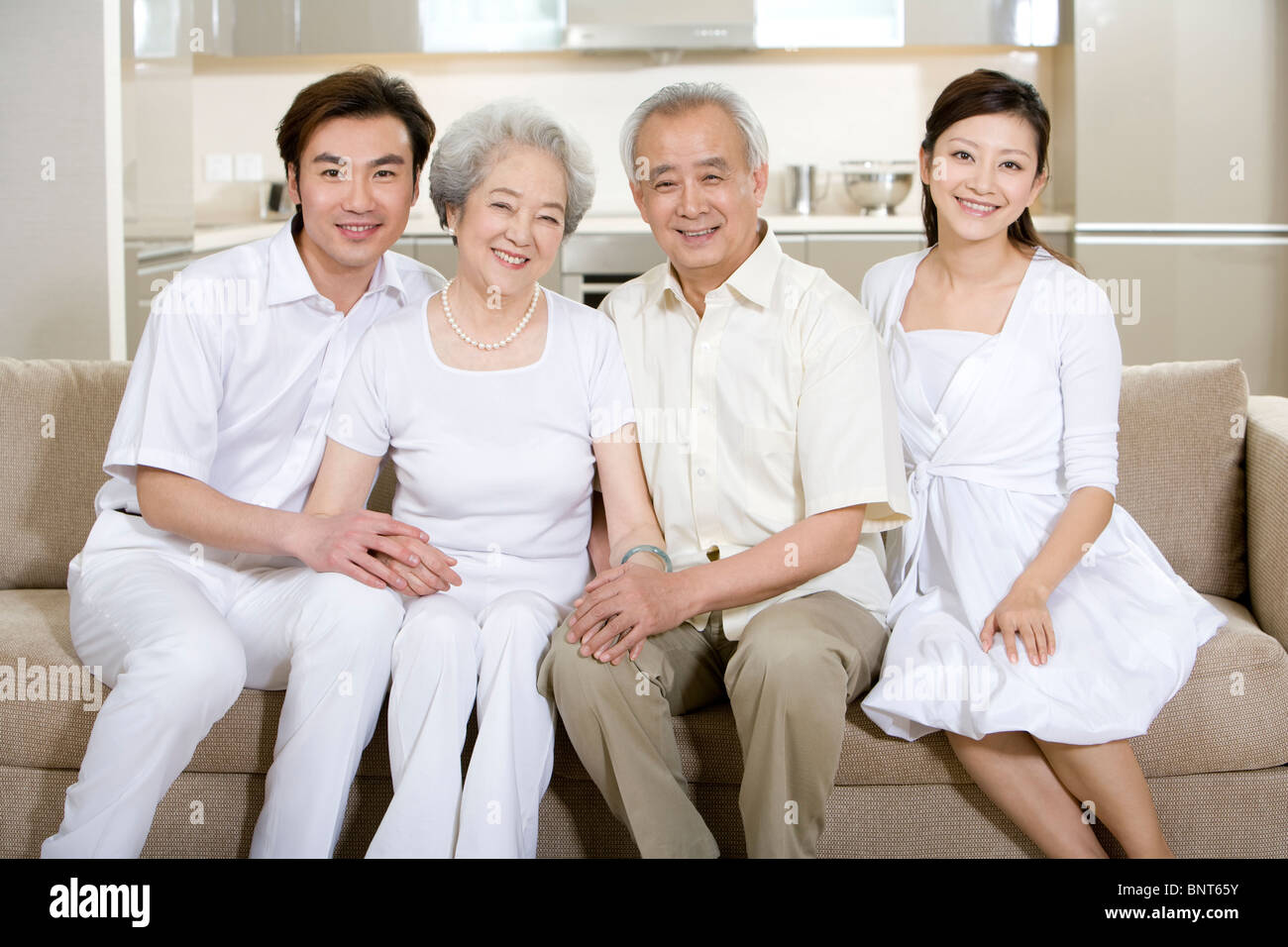 Portrait of a two generation family with adult offspring Stock Photo ...