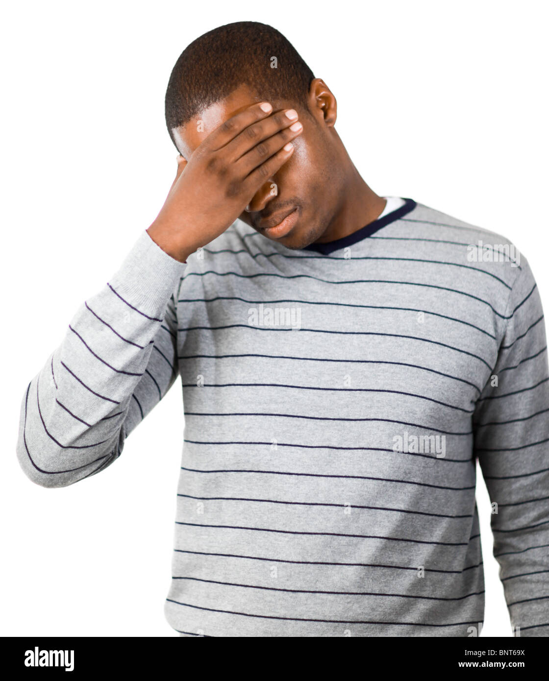 Stressed man with hand on his forehead Stock Photo - Alamy