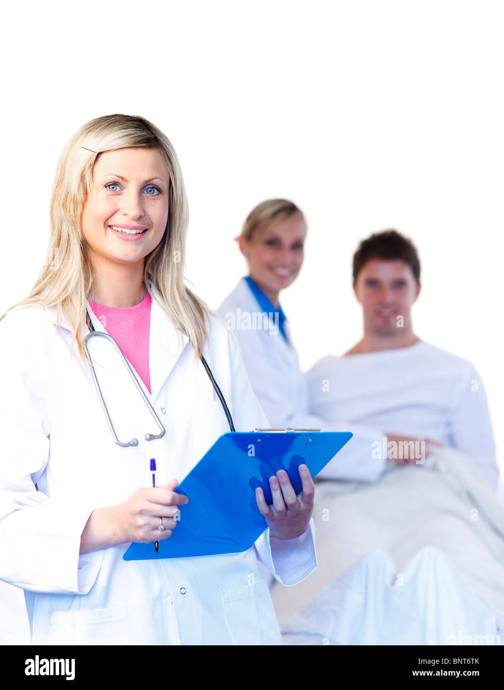 Beautiful young doctors with a patient Stock Photo - Alamy