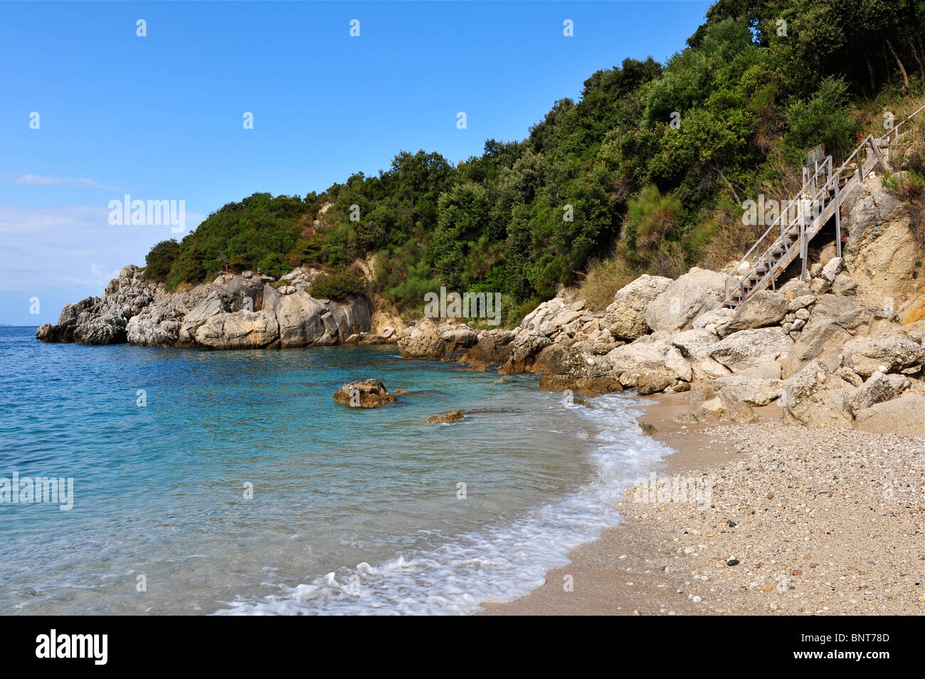 Wooden steps from a villa descend onto the beach at Sarakina beach in ...