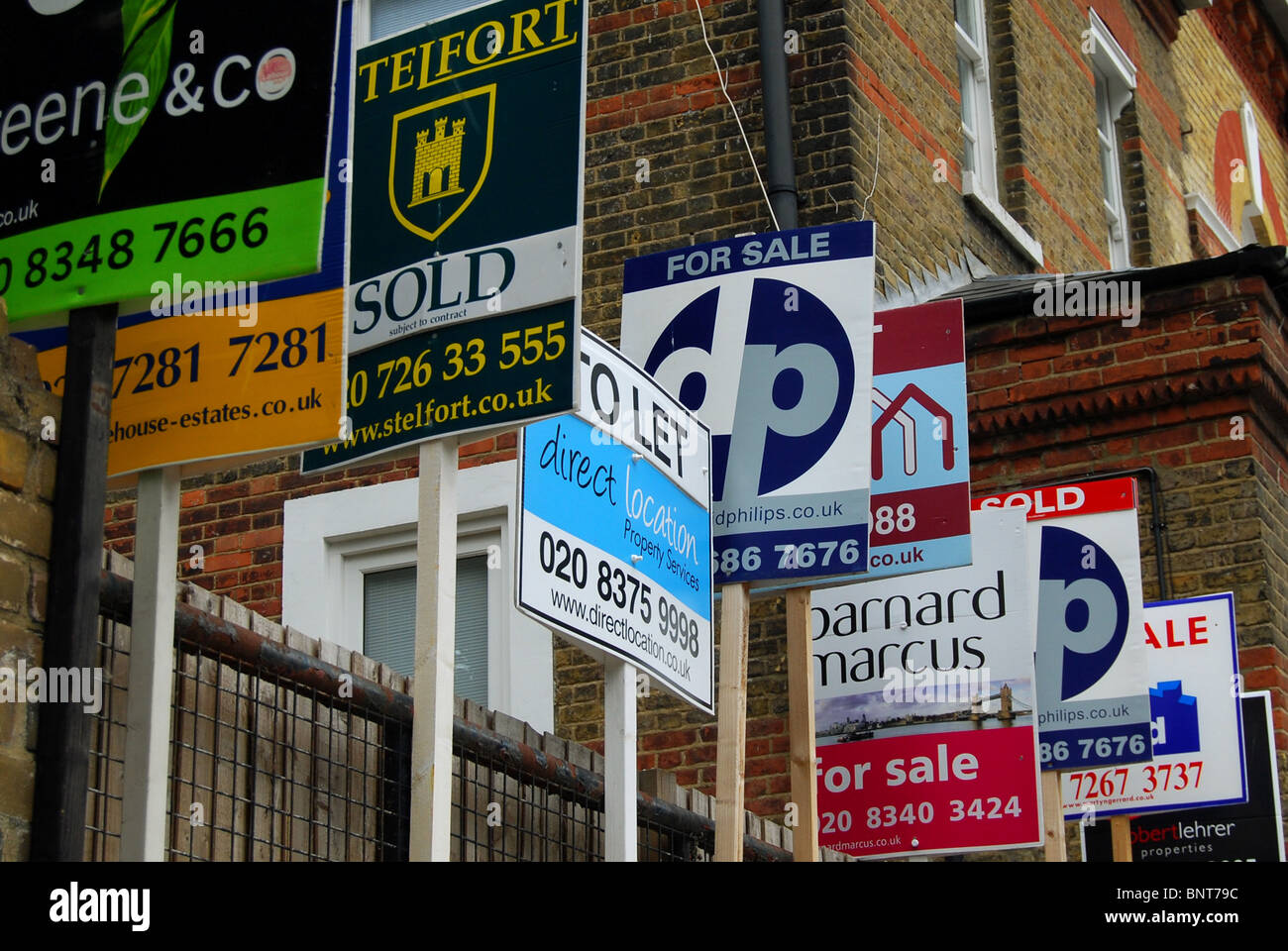 Multiple For Sale Signs on view outside a property in London, United ...