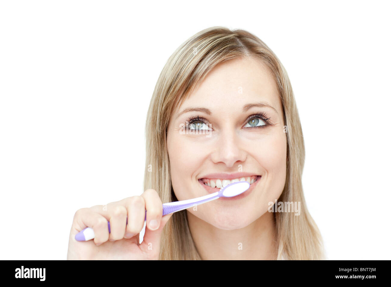 Portrait of an attractive woman brushing her teeth Stock Photo - Alamy