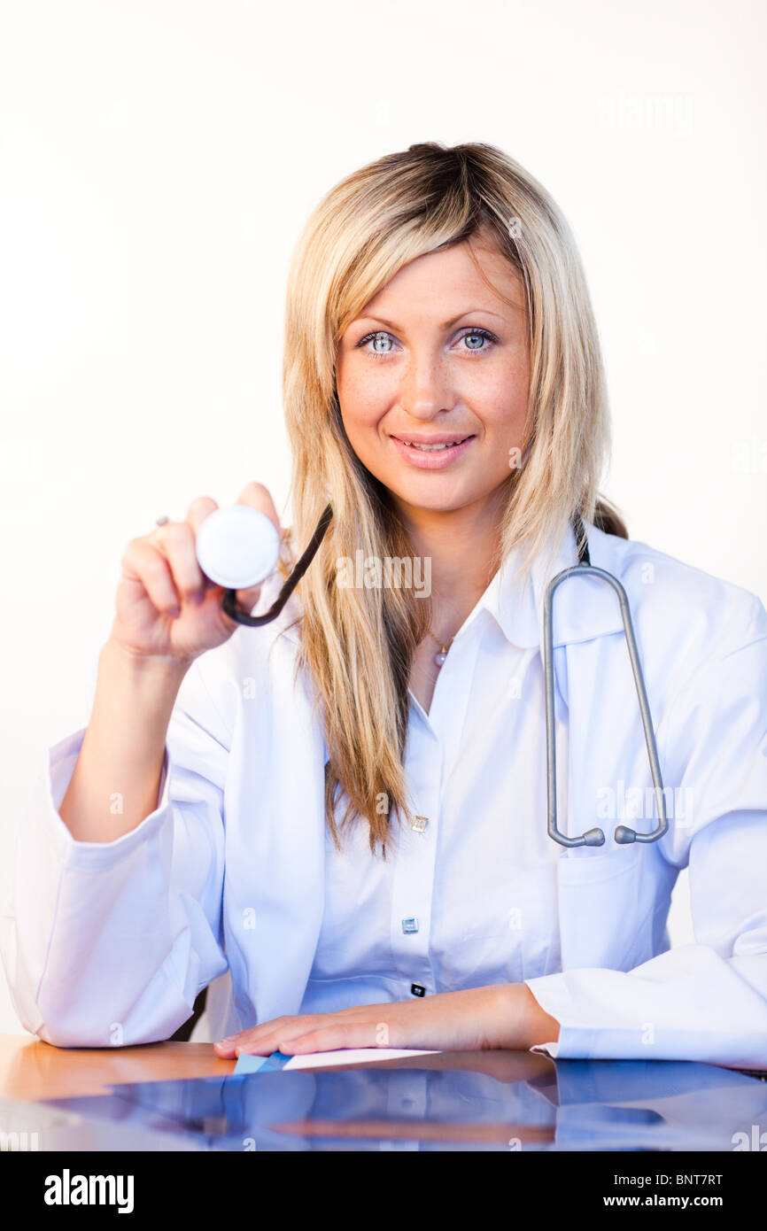 Smiling blonde doctor examining x-rays Stock Photo - Alamy
