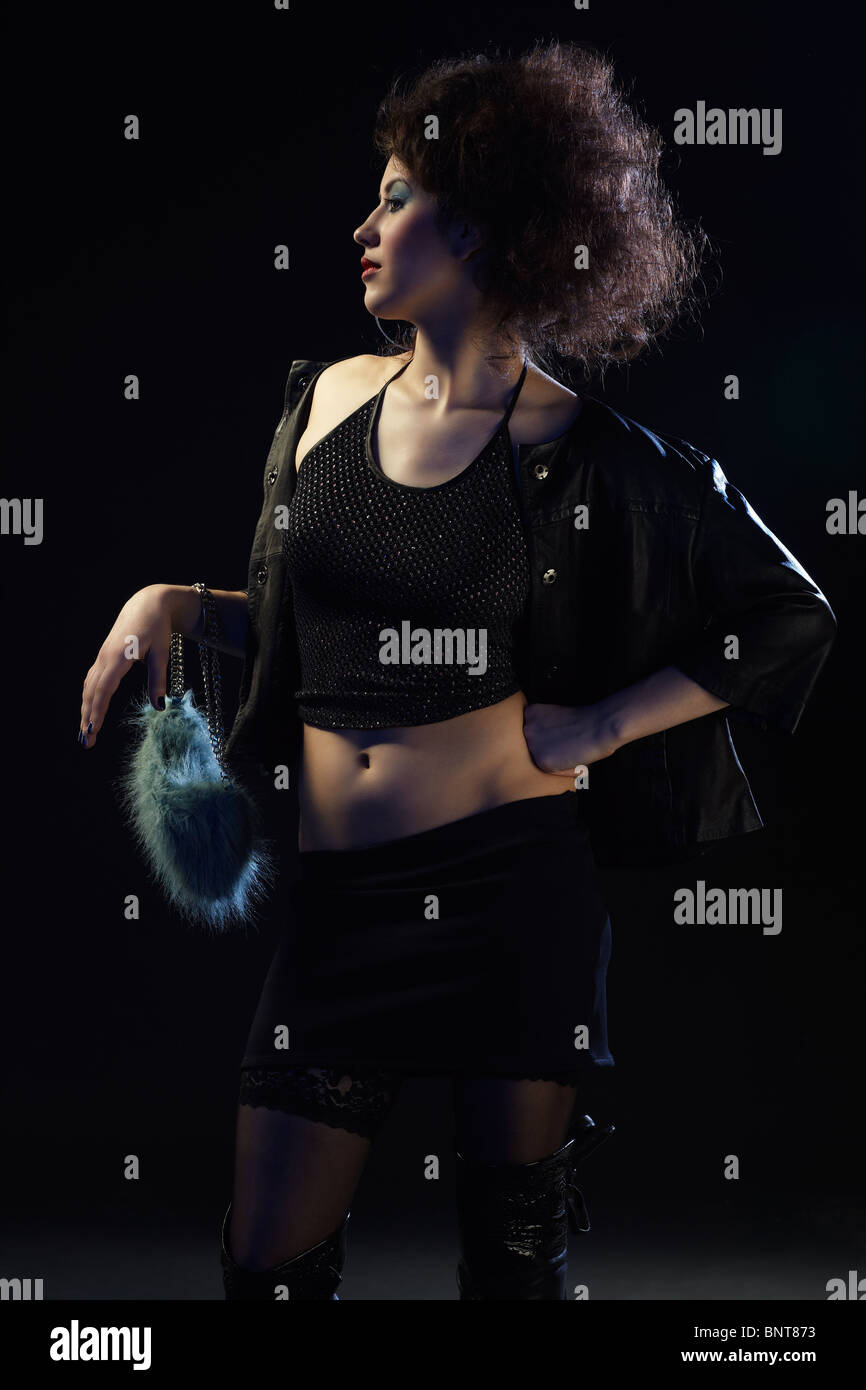 portrait of girl dressed like hooker posing on black Stock Photo - Alamy