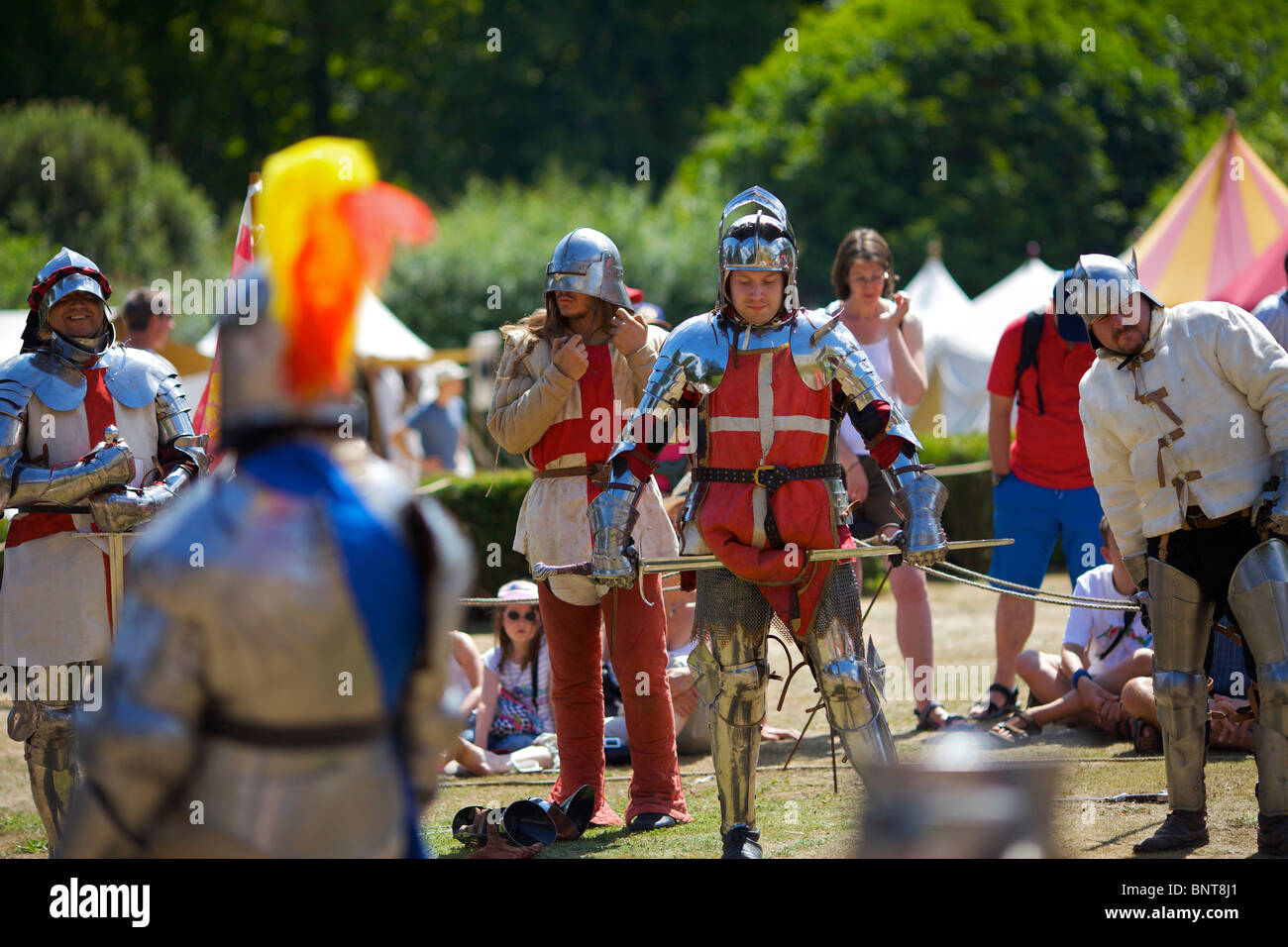 Dressed in authentic armour and using real swords re-enactors duel as ...