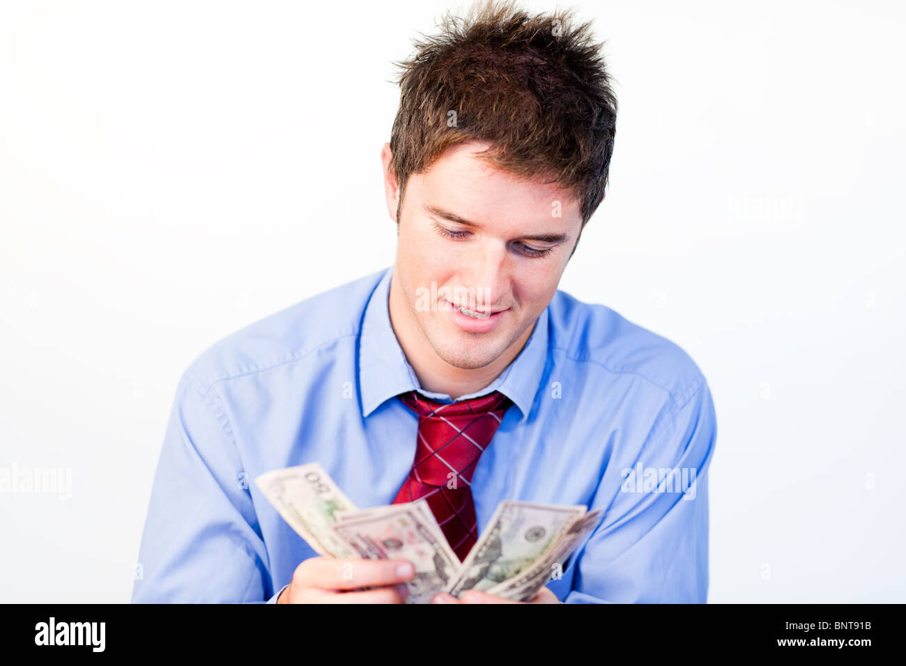Portrait of man counting money Stock Photo - Alamy