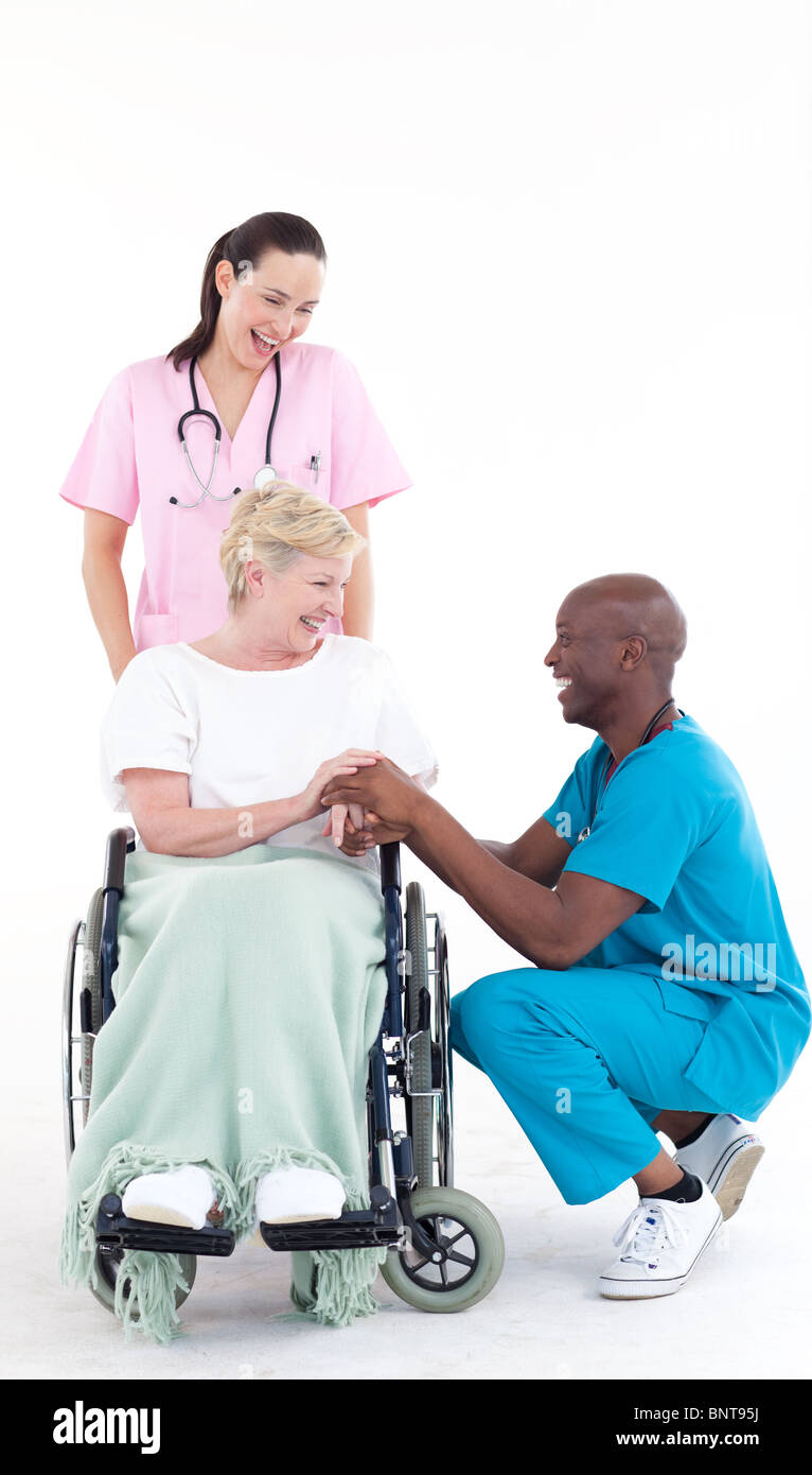 Doctors with a patient in a wheel chair Stock Photo - Alamy