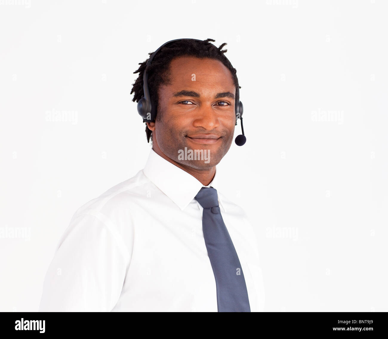 Attractive working with headset Stock Photo - Alamy