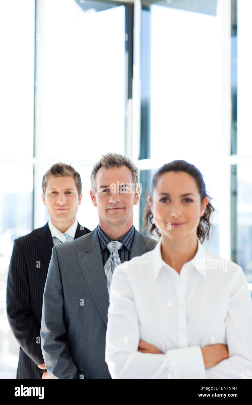 Matureusinessman in a line with his business team Stock Photo - Alamy