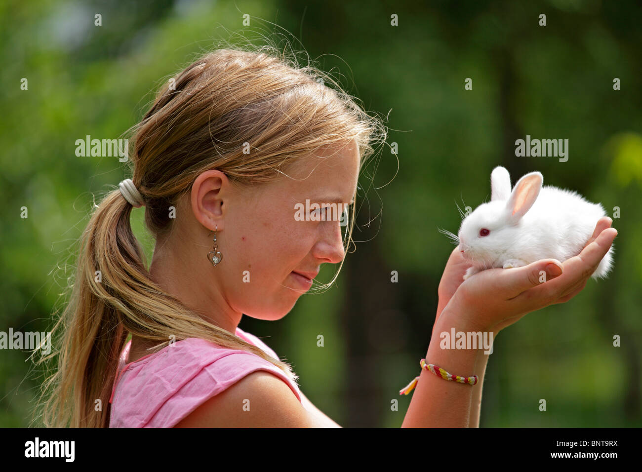 Girl holding a rabbit hi-res stock photography and images - Alamy