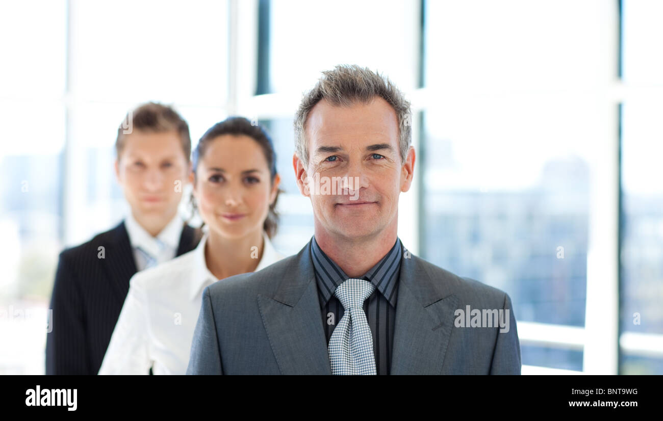 Friendly businessman leading a business team Stock Photo - Alamy