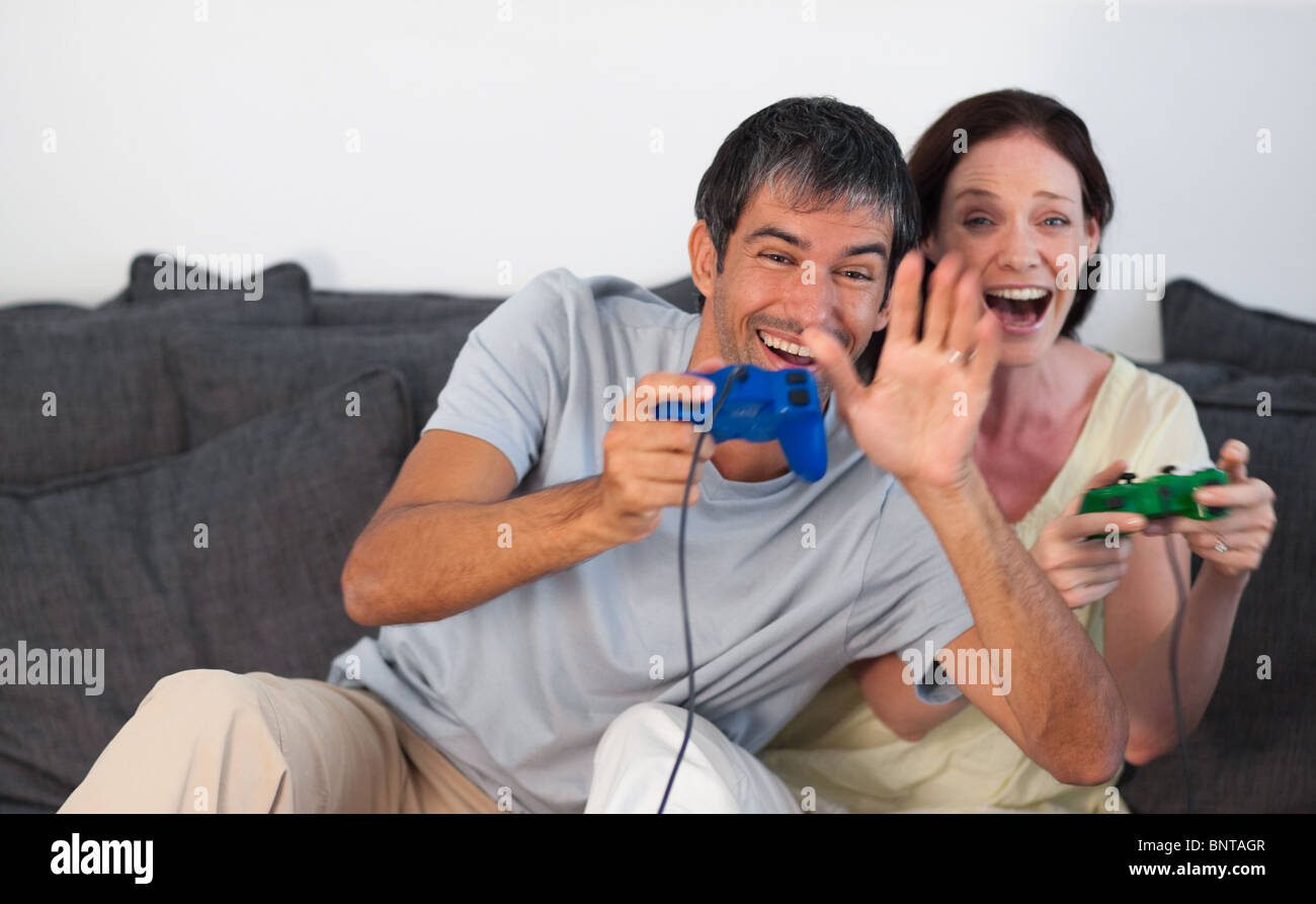 Beautiful family playing video games Stock Photo - Alamy