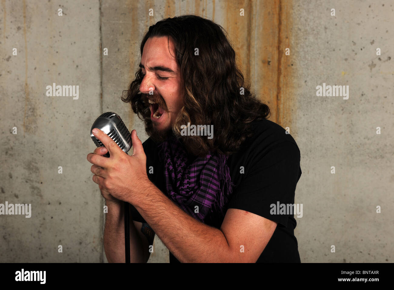 Screaming into mic hi-res stock photography and images - Alamy