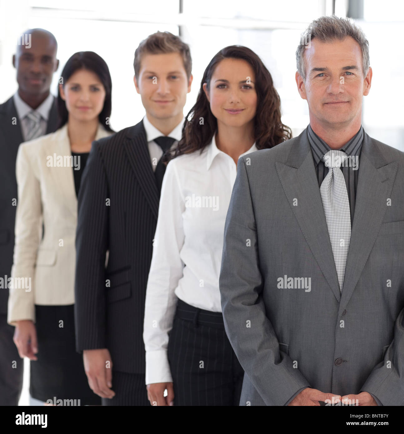 Smiling senior busienss leader Stock Photo - Alamy