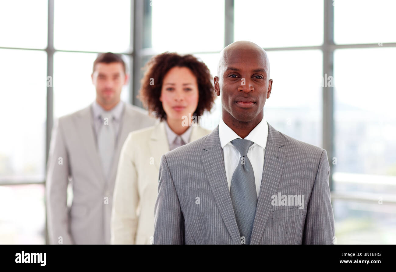 Serious businessman leading his colleagues Stock Photo - Alamy