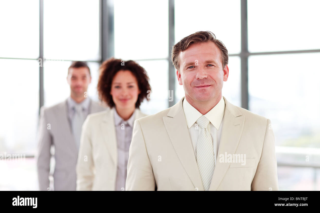 Mature businessman leading a team Stock Photo - Alamy
