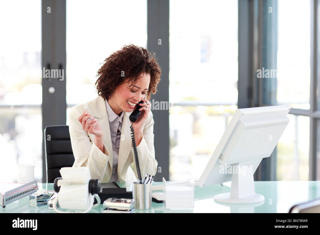 Attractive manager on the phone Stock Photo - Alamy
