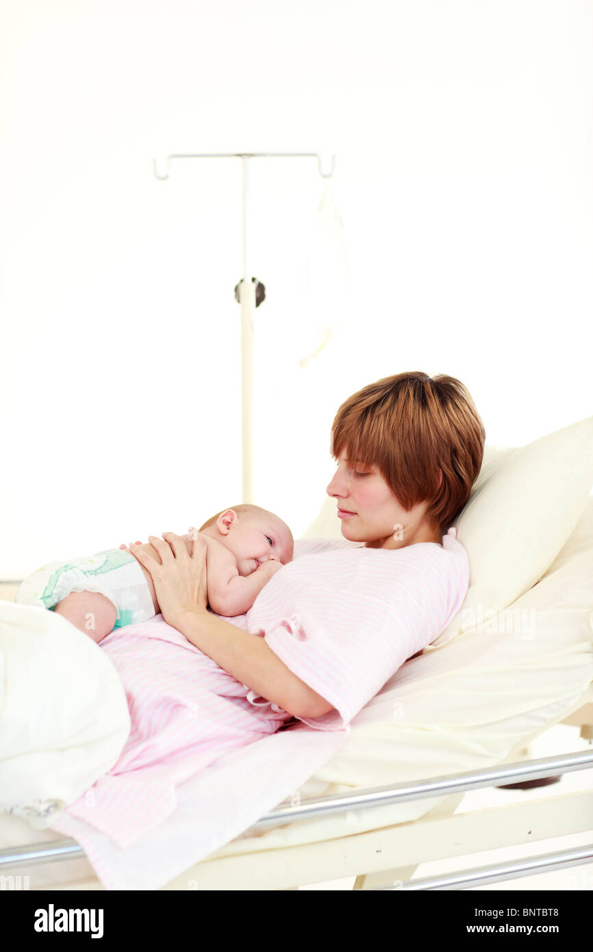 Mother taking care of her newborn baby with copy-space Stock Photo - Alamy